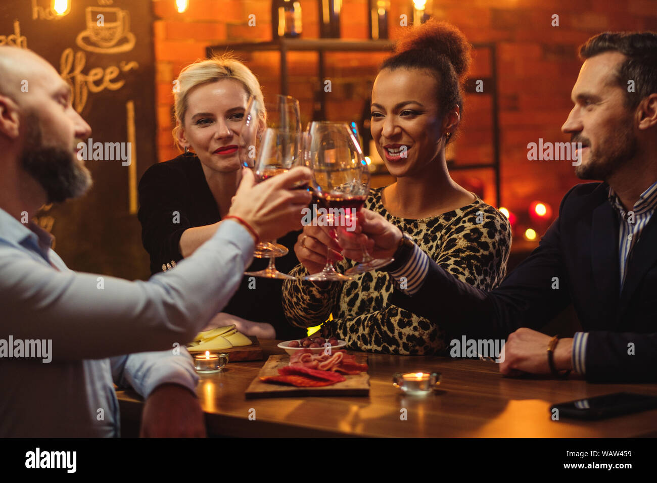 Group of friends having fun talk behind bar counter in a cafe Stock ...