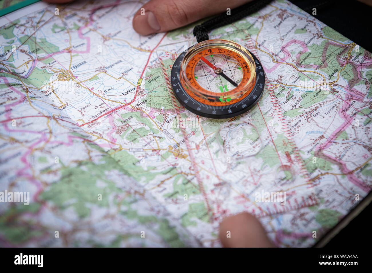 man holding compass and map Stock Photo - Alamy