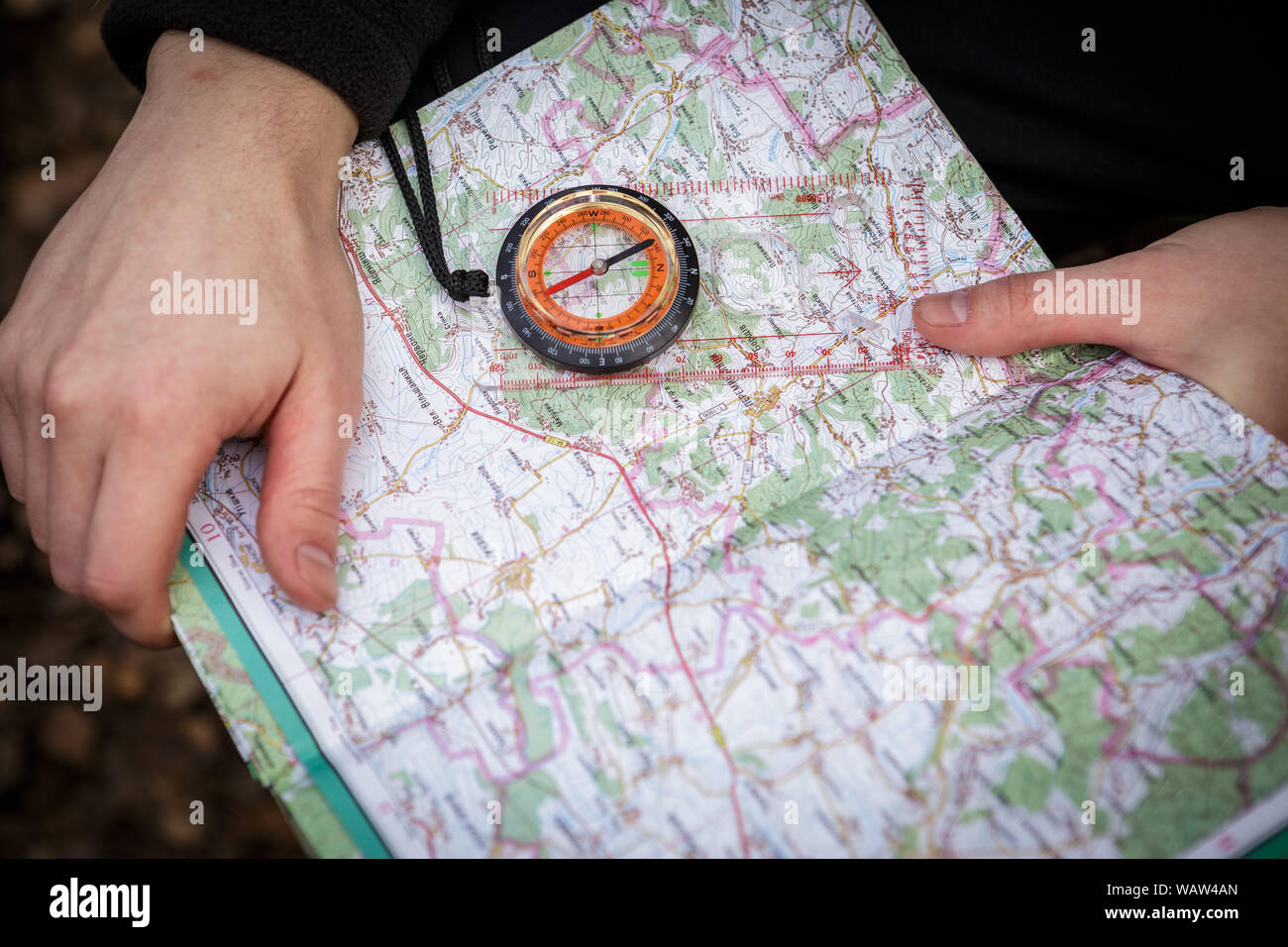 man holding compass and map Stock Photo - Alamy