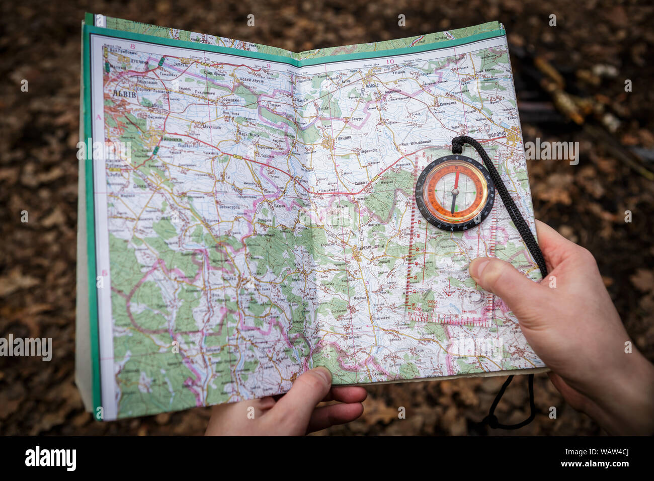 man holding compass and map Stock Photo - Alamy