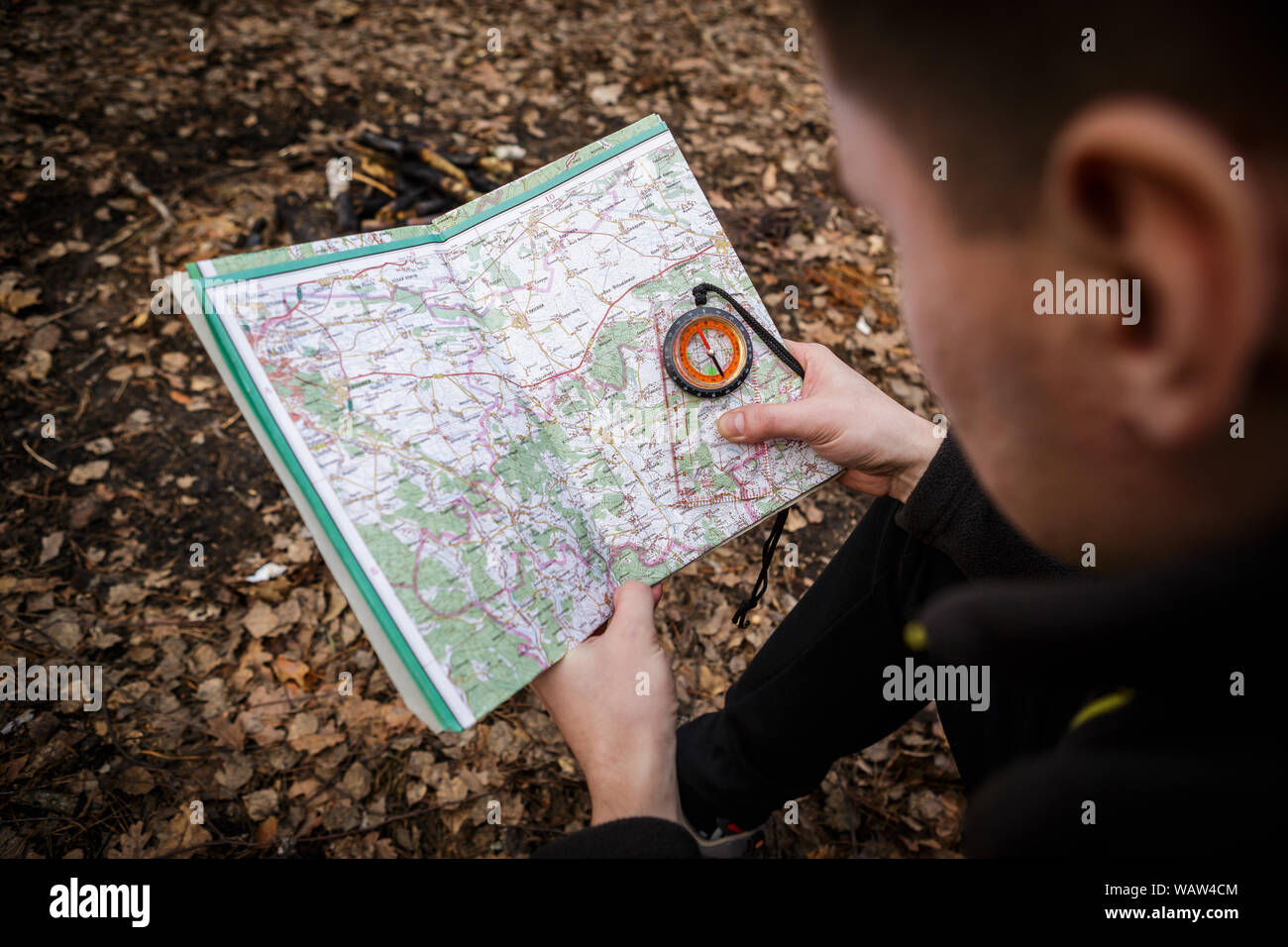 man holding compass and map Stock Photo - Alamy