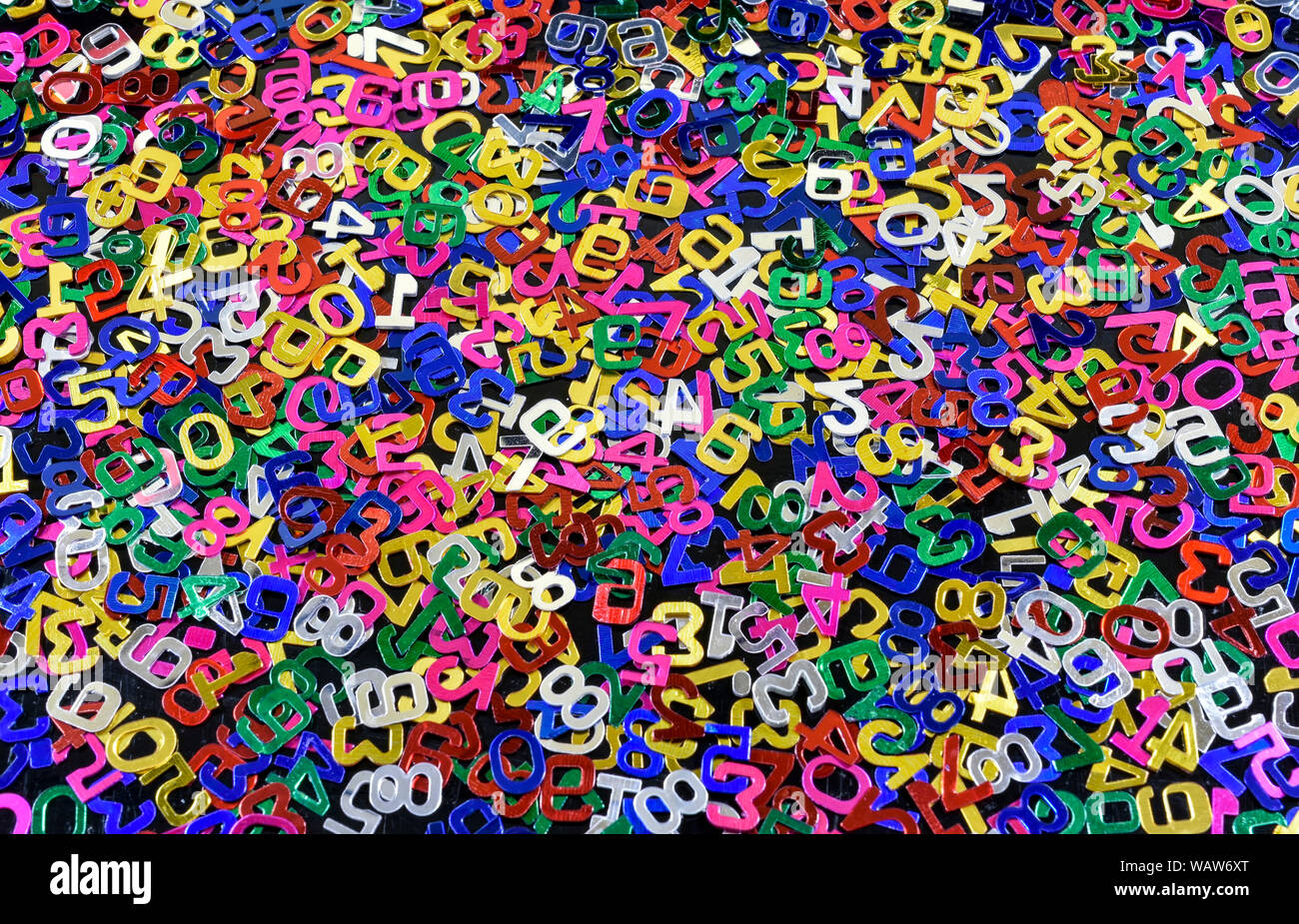 Colored background with multiple small plastic numbers Stock Photo - Alamy