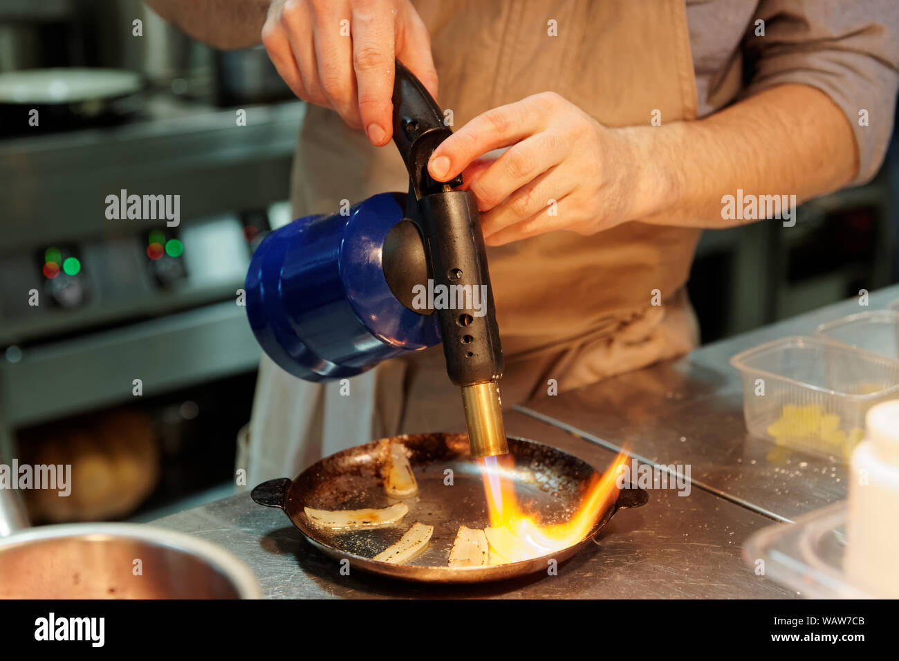 Hand holding gas burner hi-res stock photography and images - Alamy