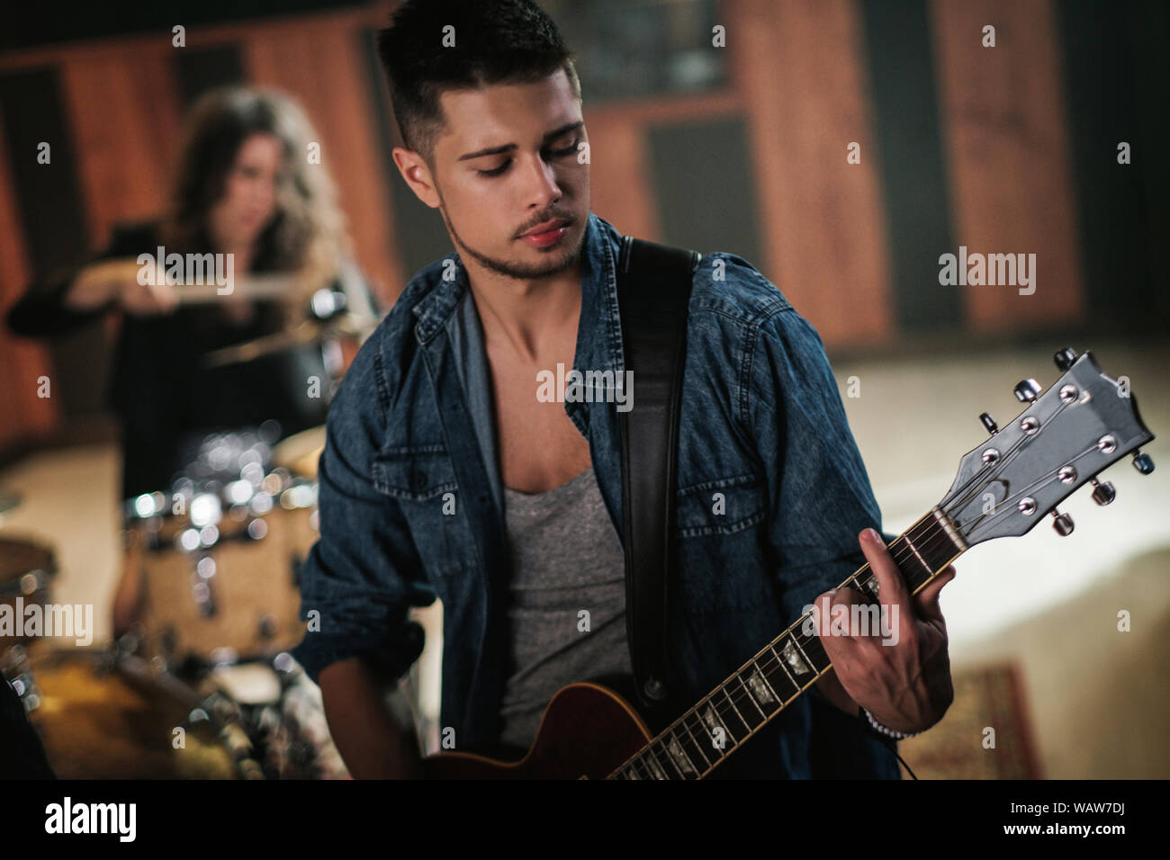 Music band having rehearsal in a studio Stock Photo - Alamy
