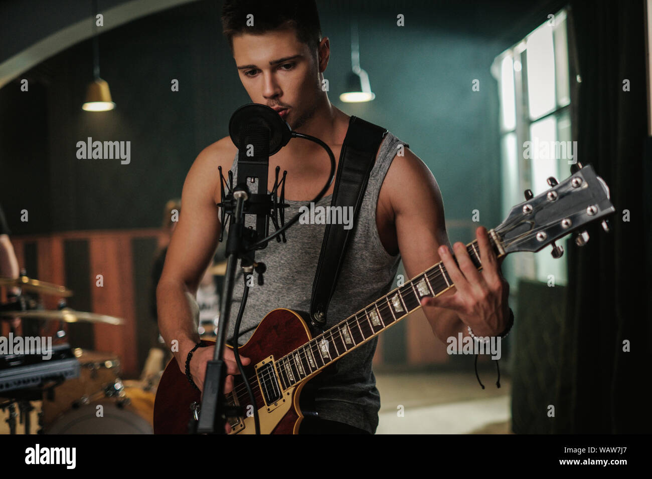 Music band having rehearsal in a studio Stock Photo - Alamy