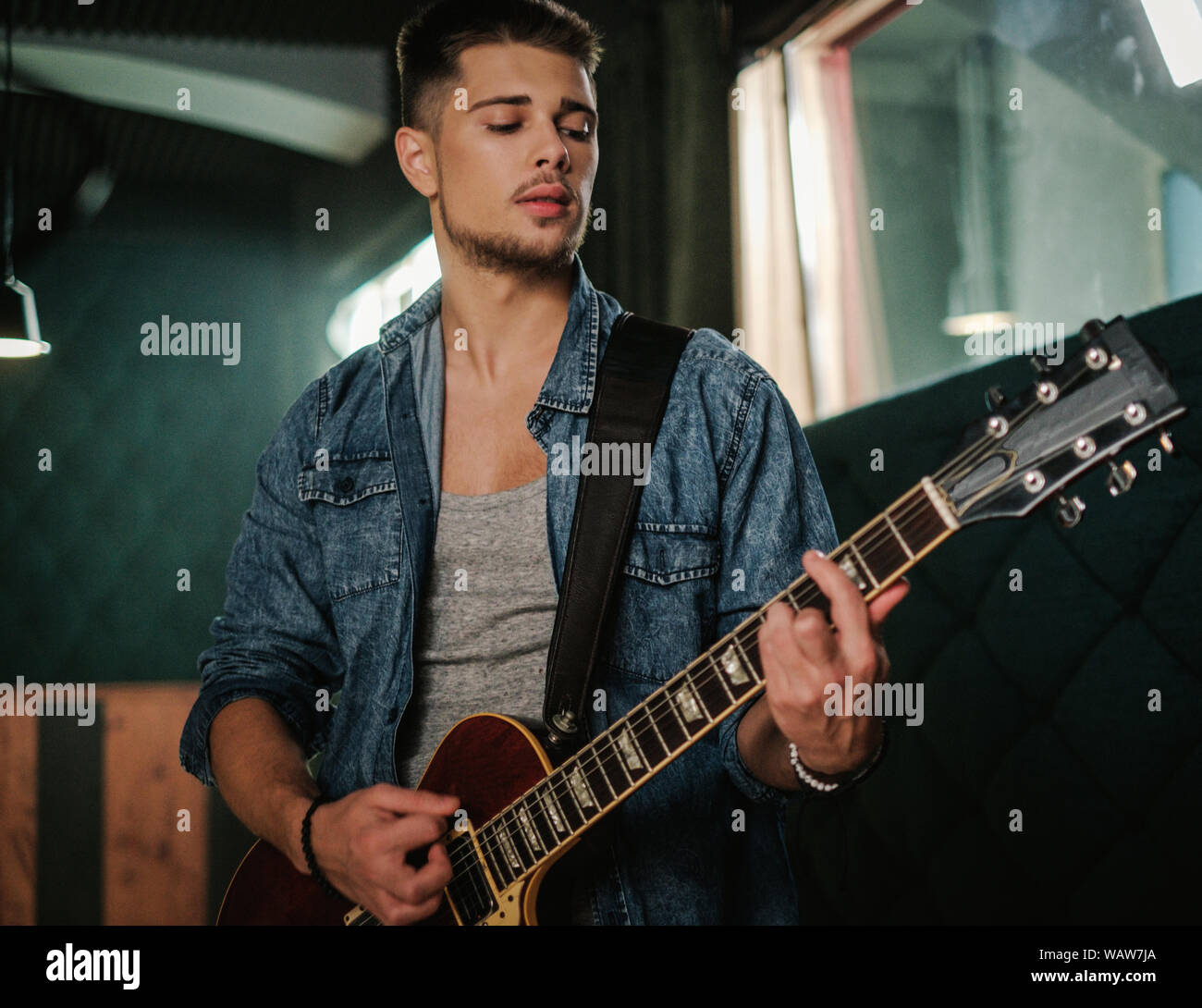 Music band having rehearsal in a studio Stock Photo - Alamy