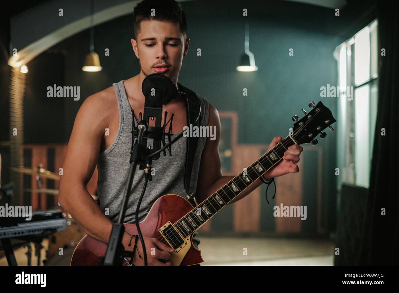 Music band having rehearsal in a studio Stock Photo - Alamy