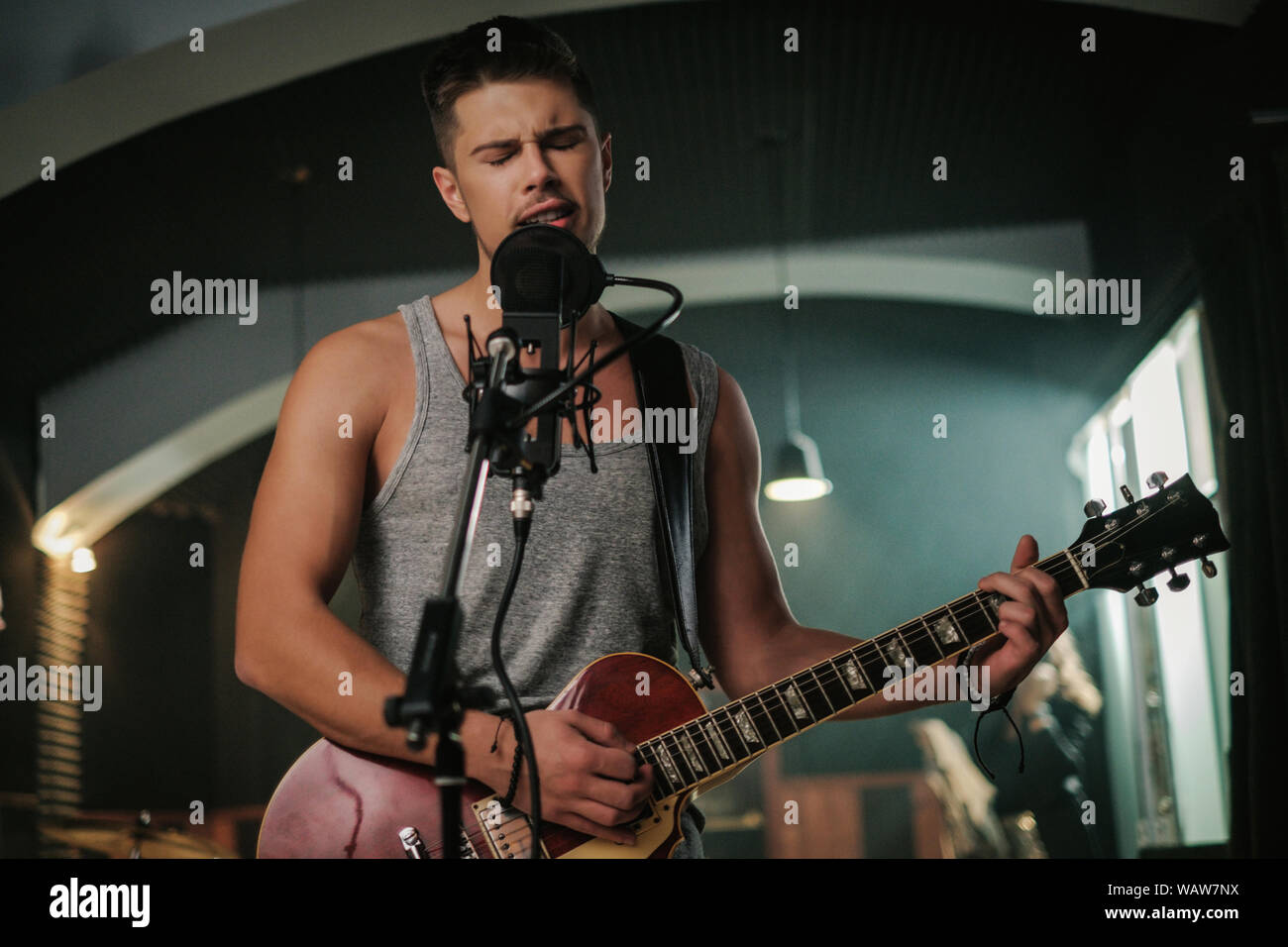 Music band having rehearsal in a studio Stock Photo - Alamy