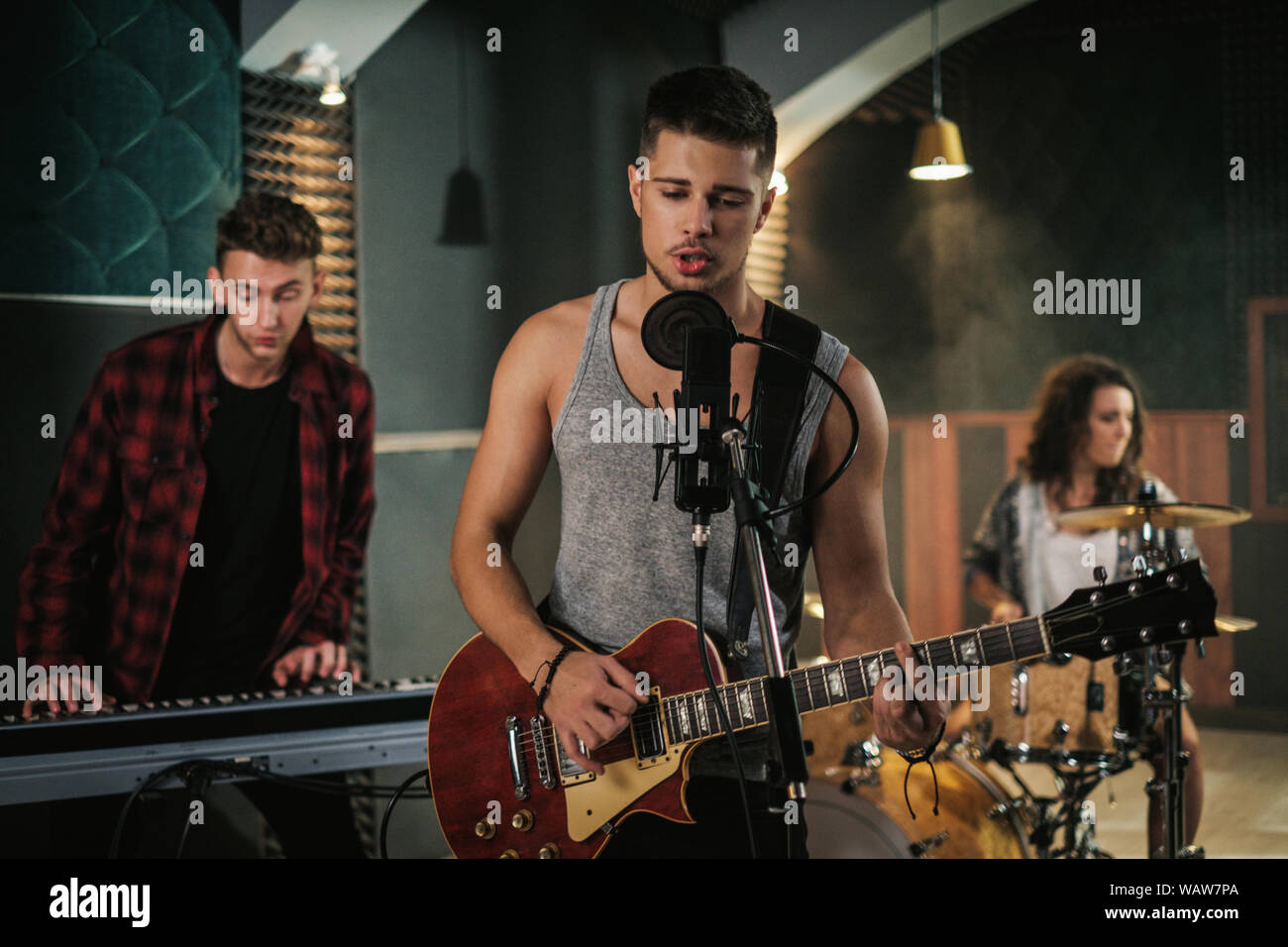 Music band having rehearsal in a studio Stock Photo - Alamy