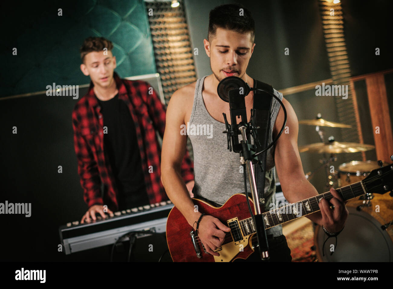 Music band having rehearsal in a studio Stock Photo - Alamy