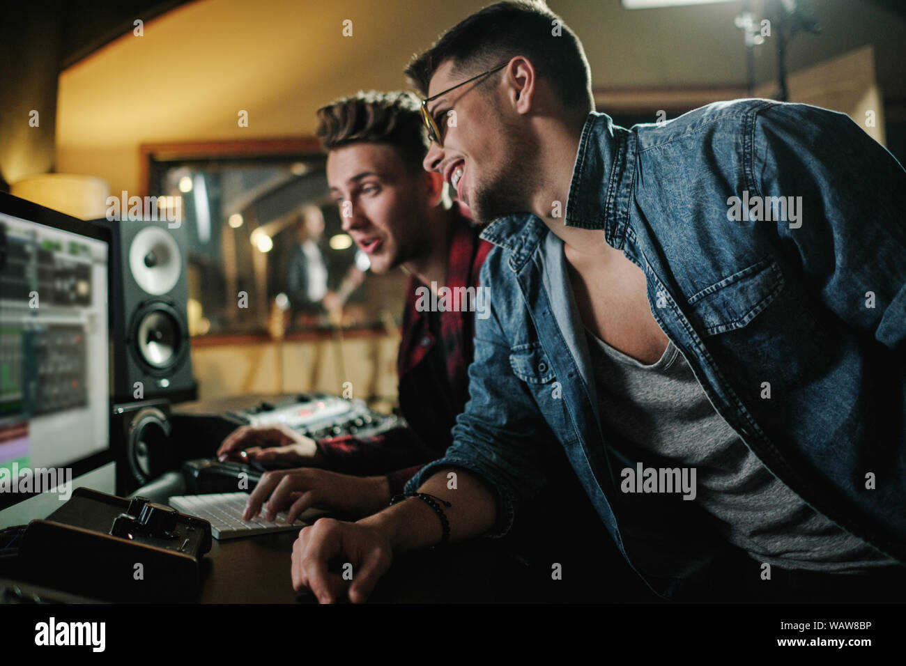 Sound engineer working in a music studio Stock Photo - Alamy