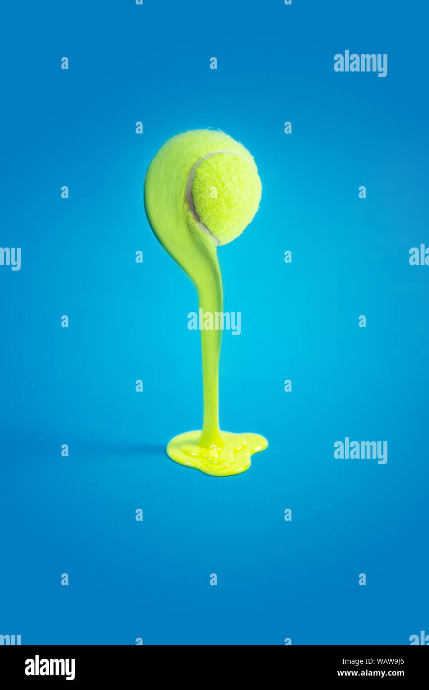 Creative concept photo of tennis ball melting Stock Photo - Alamy