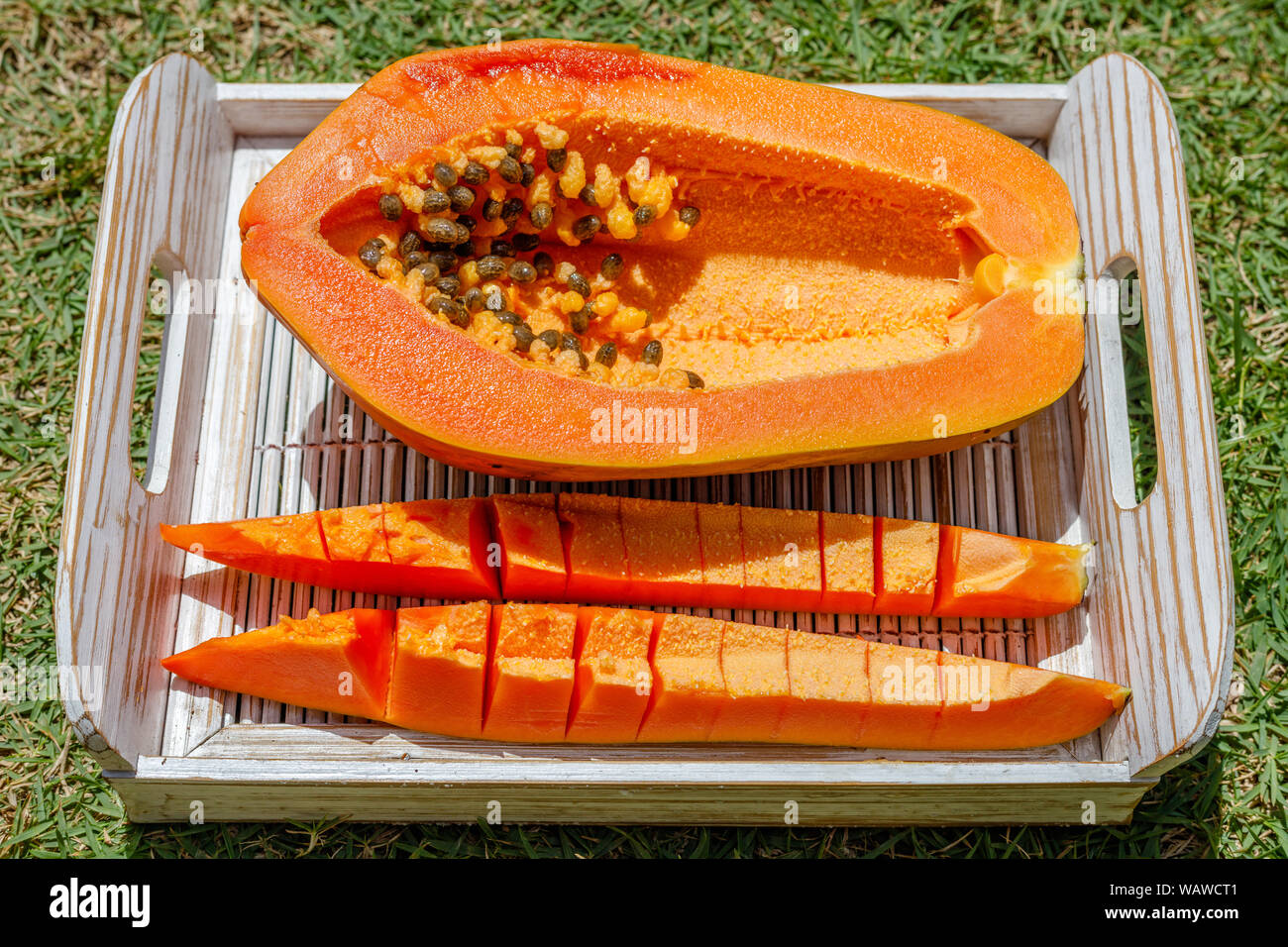 Fresh papaya, a half and slices. Bali, Indonesia Stock Photo - Alamy