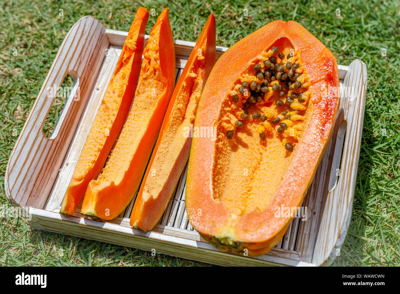 Fresh papaya, a half and slices. Bali, Indonesia Stock Photo - Alamy