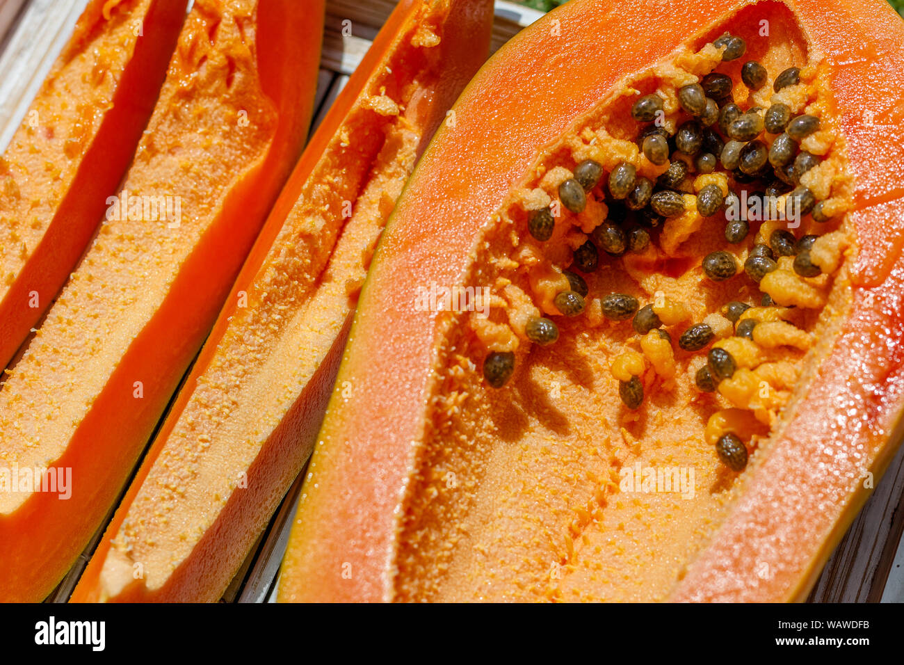 Fresh papaya, a half and slices. Bali, Indonesia Stock Photo - Alamy
