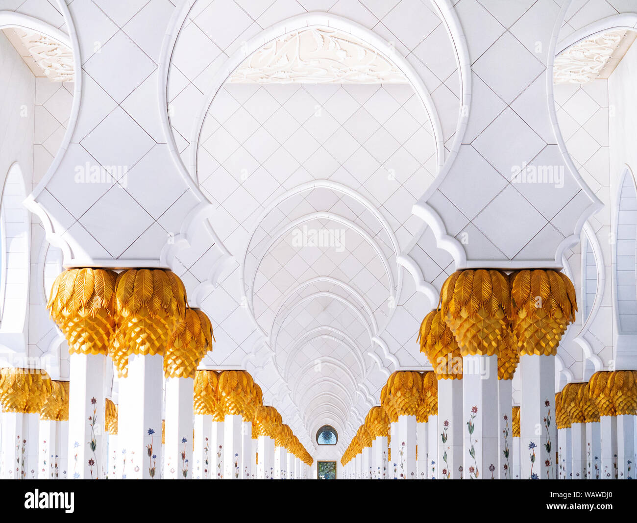 FEB 2, 2015 Abu Dhabi, UAE - White marble arch gates corridor with ...