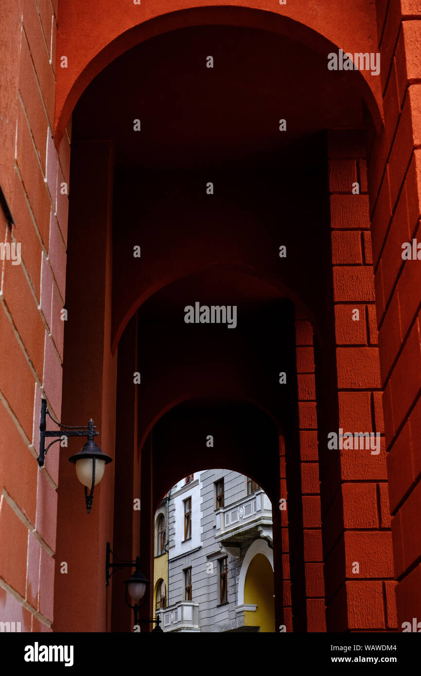 Red brick arch with a lantern. Modern architecture Stock Photo - Alamy