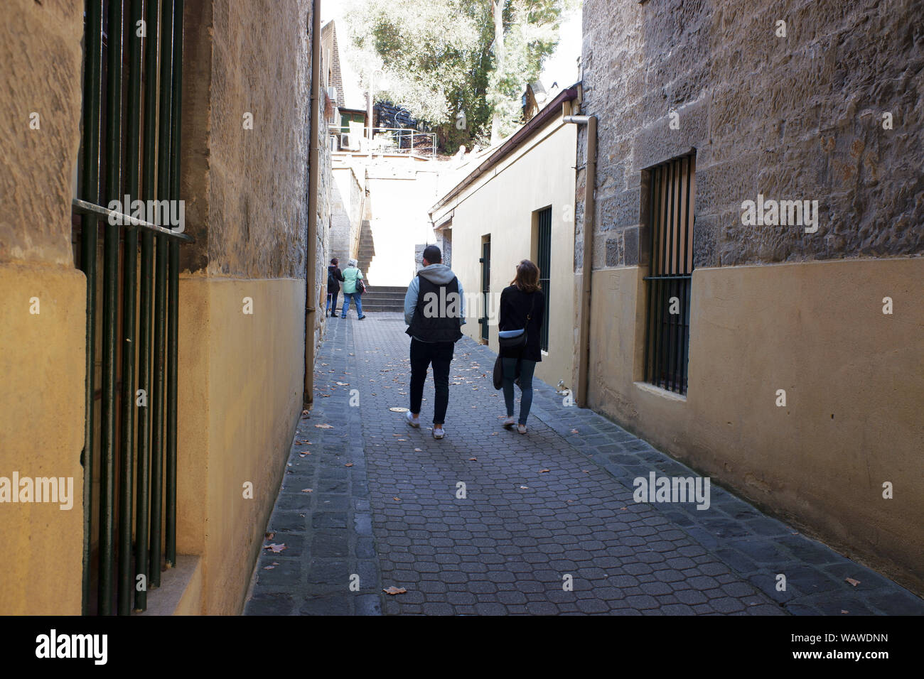 People walking through alleyway hi-res stock photography and images - Alamy