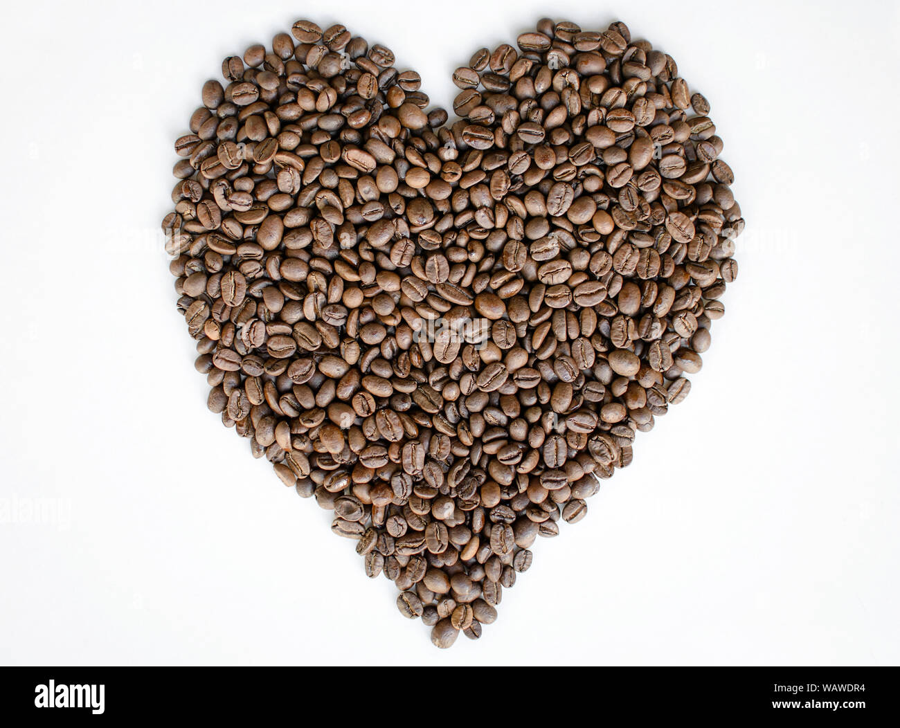 Coffee beans heart isolated on white background Stock Photo - Alamy