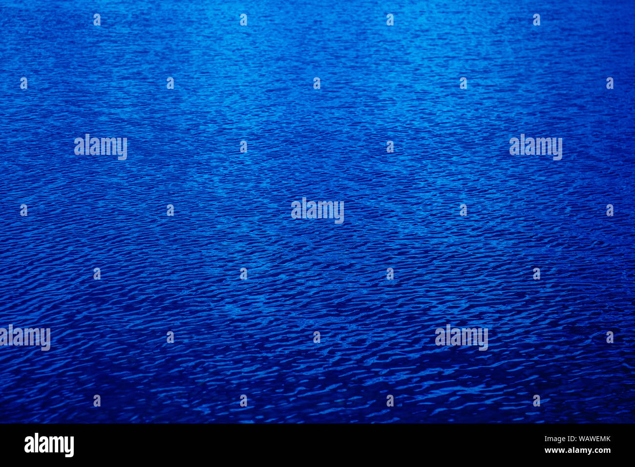 Shining dark blue wavy water surface ripple background, backdrop Stock ...