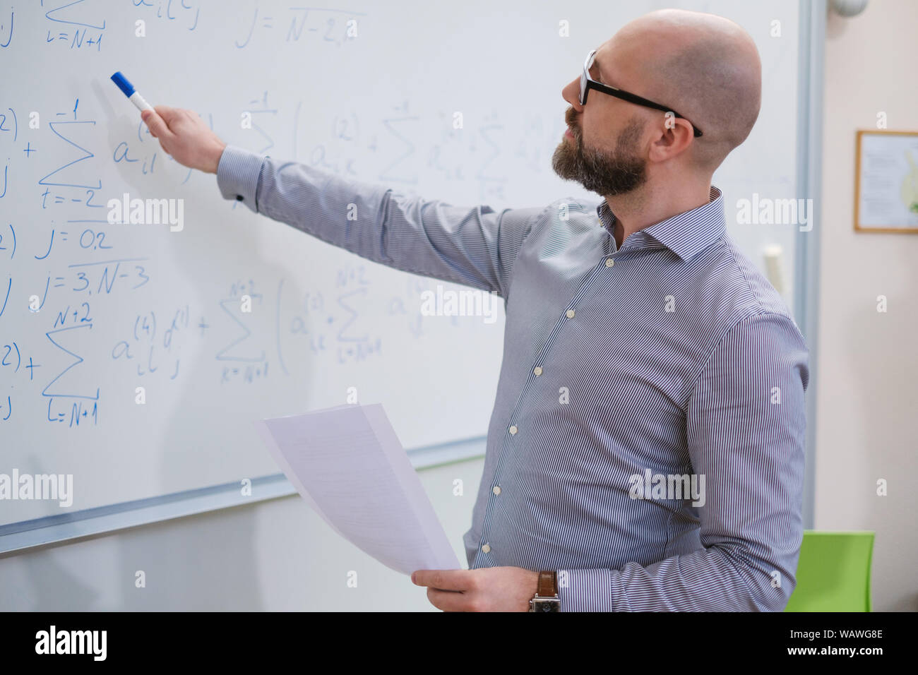 Multinational group of cheerful students taking an active part in a ...