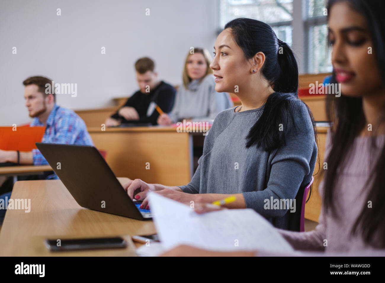 Multicultural group of students in an auditorium Stock Photo - Alamy