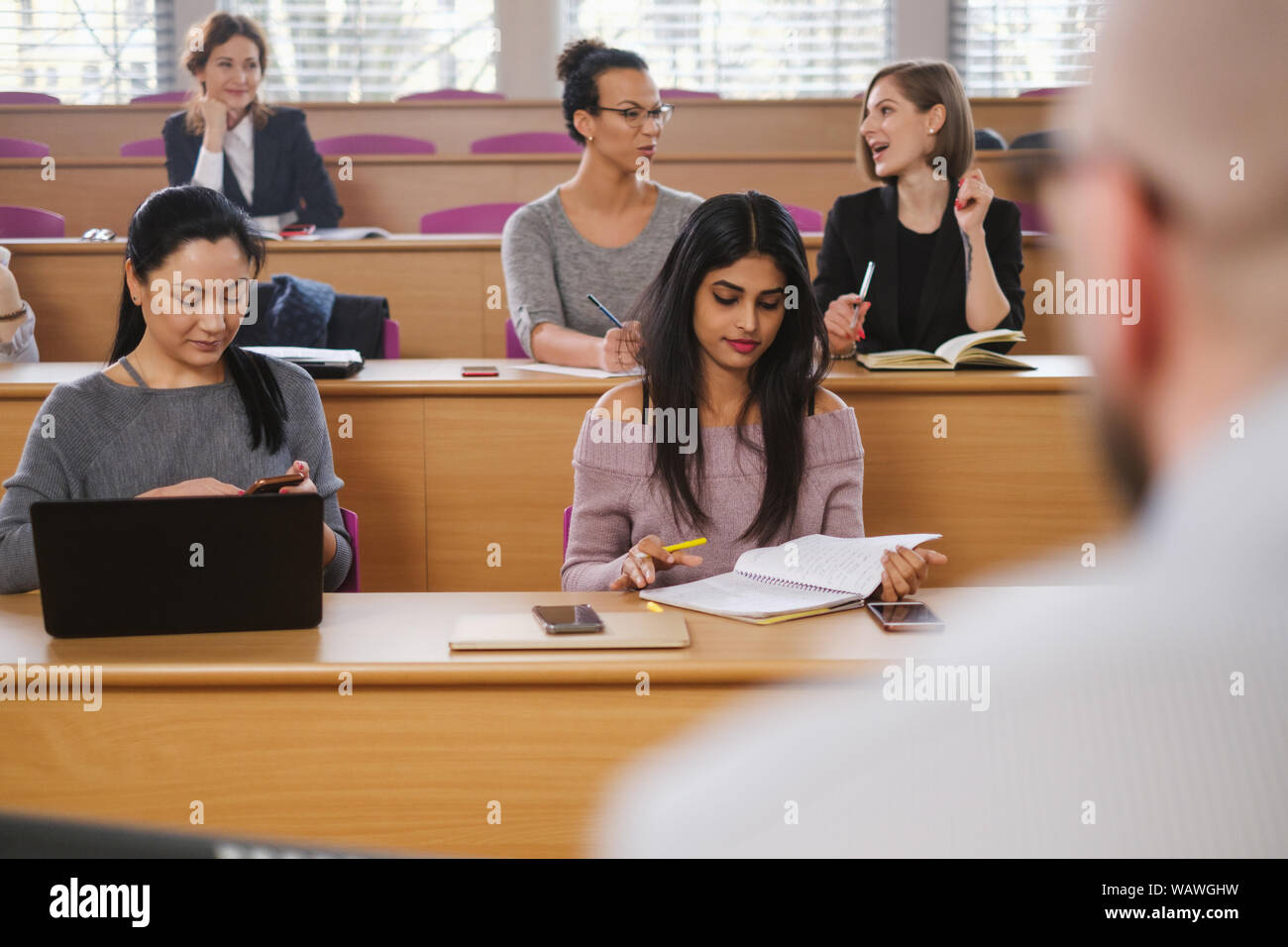 Multicultural group of students in an auditorium Stock Photo - Alamy