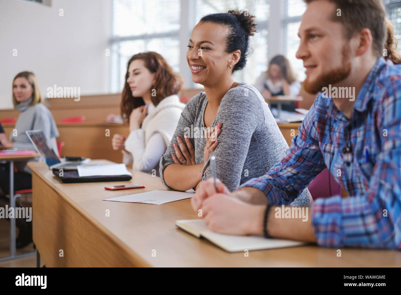 Multicultural group of students in an auditorium Stock Photo - Alamy