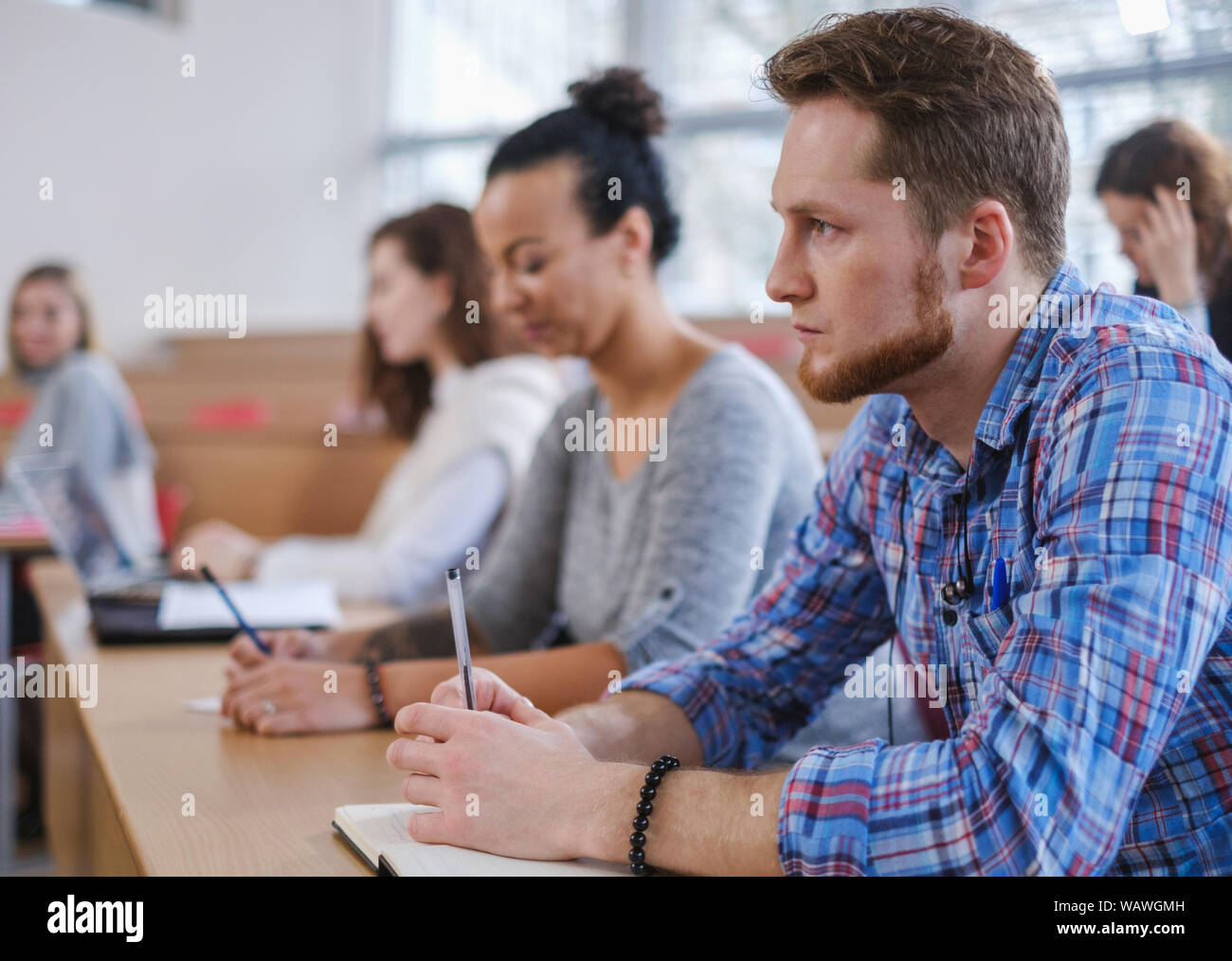 Multicultural group of students in an auditorium Stock Photo - Alamy