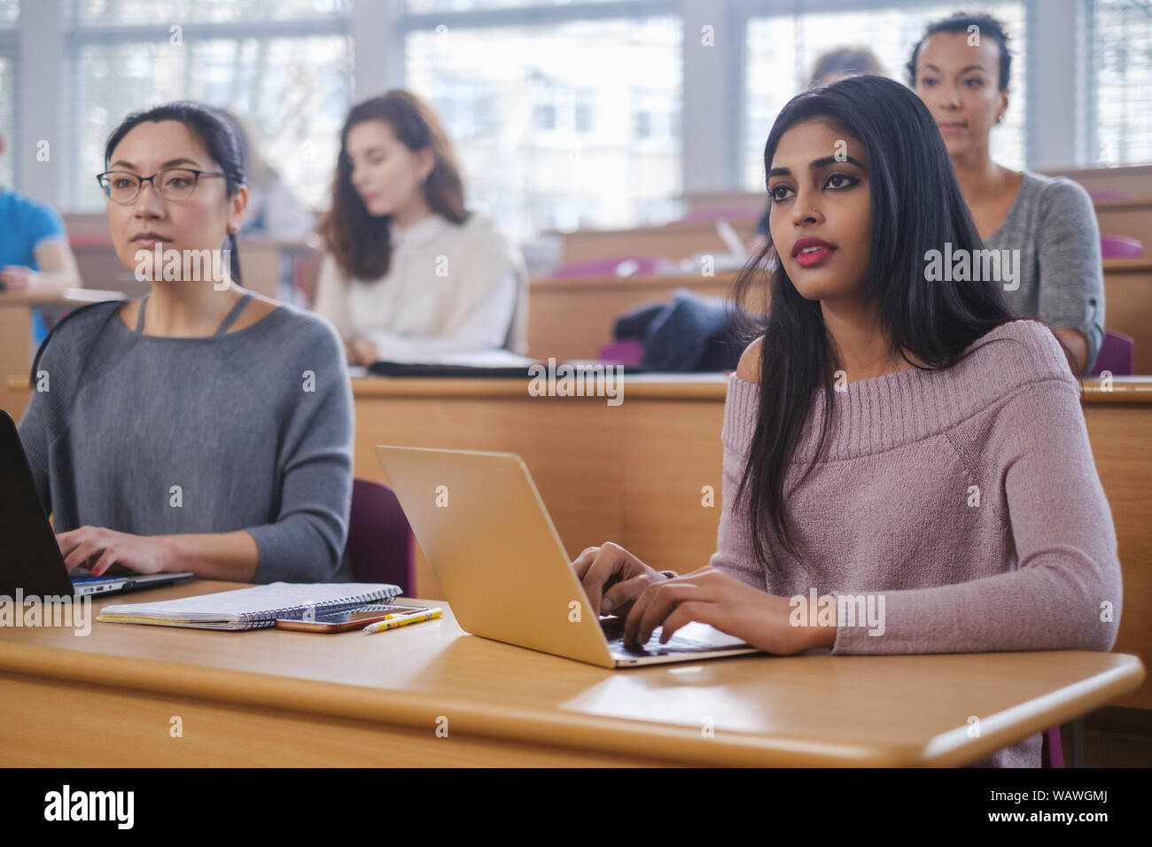Multicultural group of students in an auditorium Stock Photo - Alamy