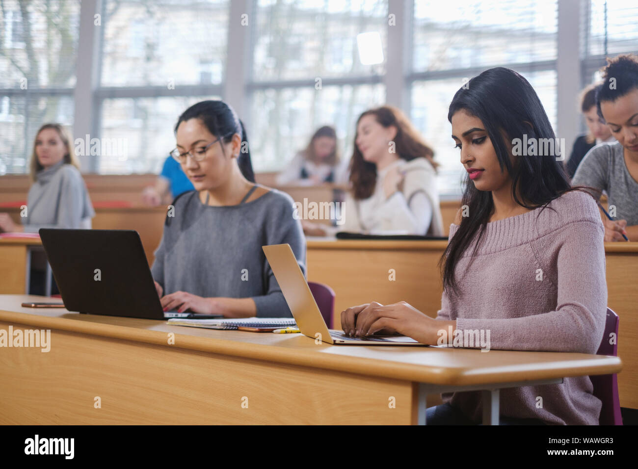 Multicultural group of students in an auditorium Stock Photo - Alamy
