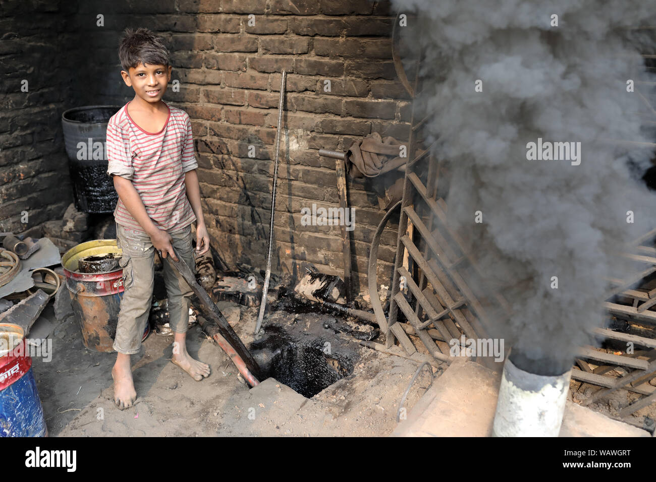 Child worker in a shipyard in Dhaka, Bangladesh. Bangladesh has over 4. ...