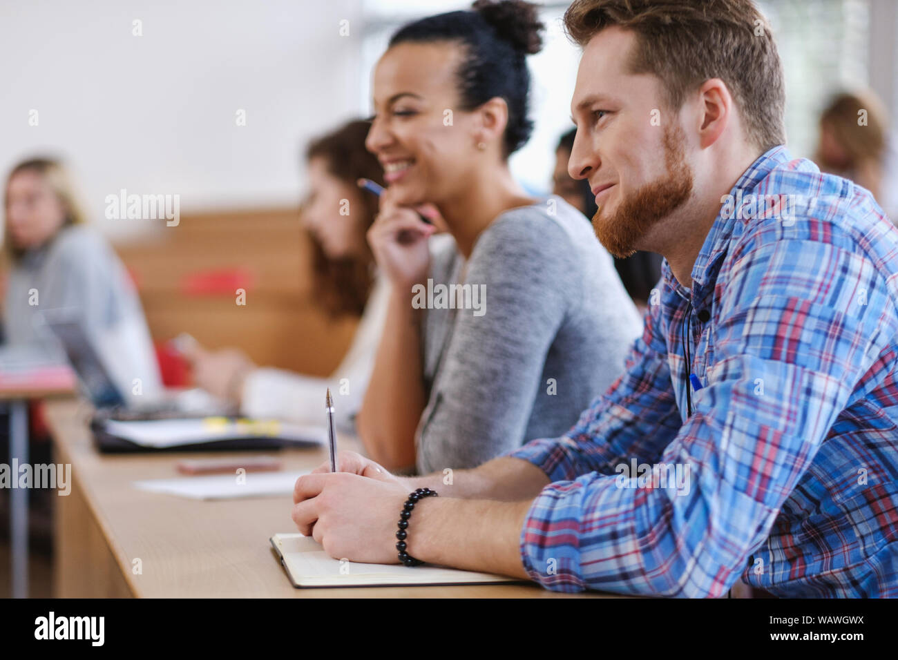 Multicultural group of students in an auditorium Stock Photo - Alamy