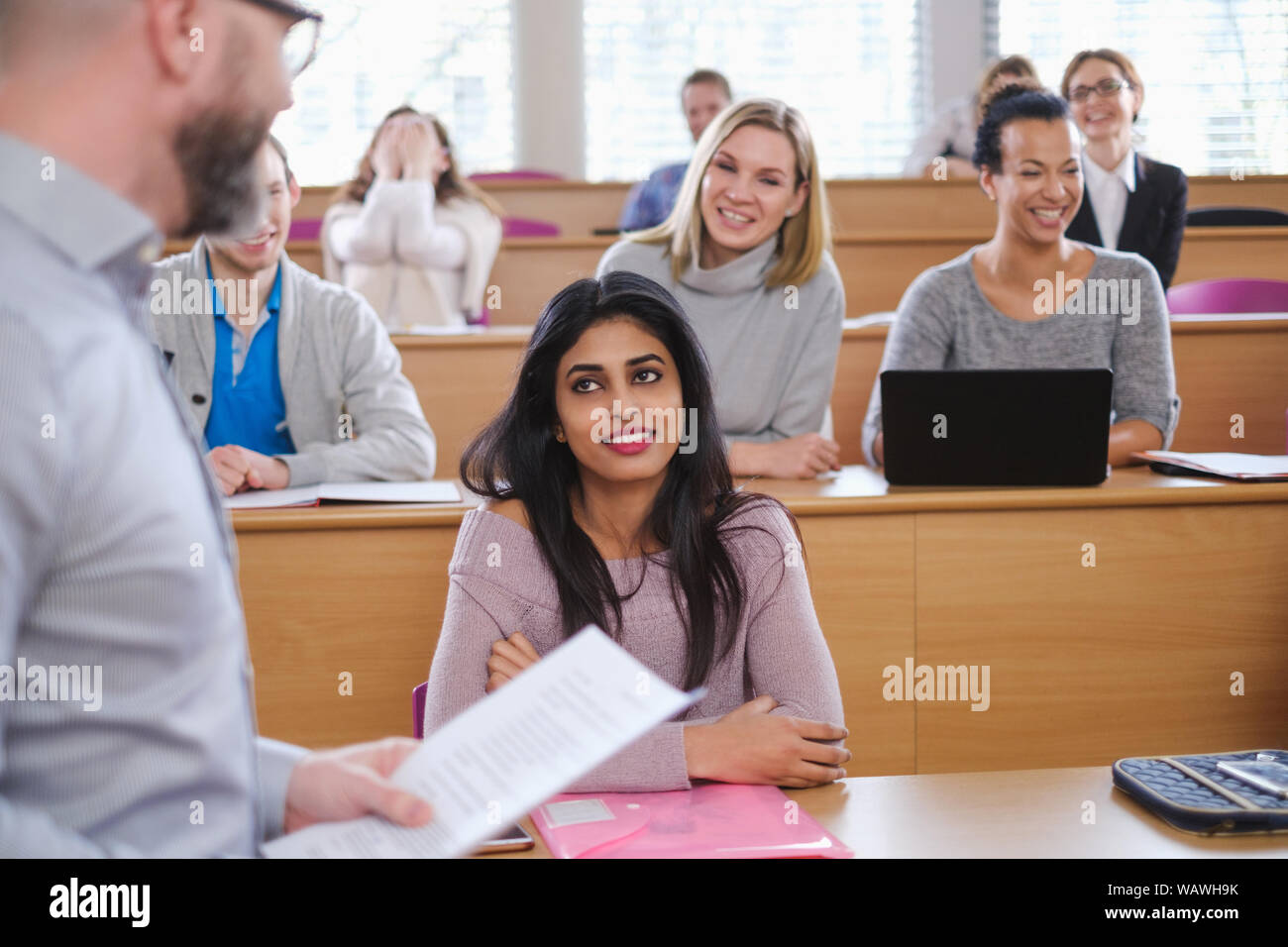 Lecturer and multinational group of students in an auditorium Stock Photo - Alamy