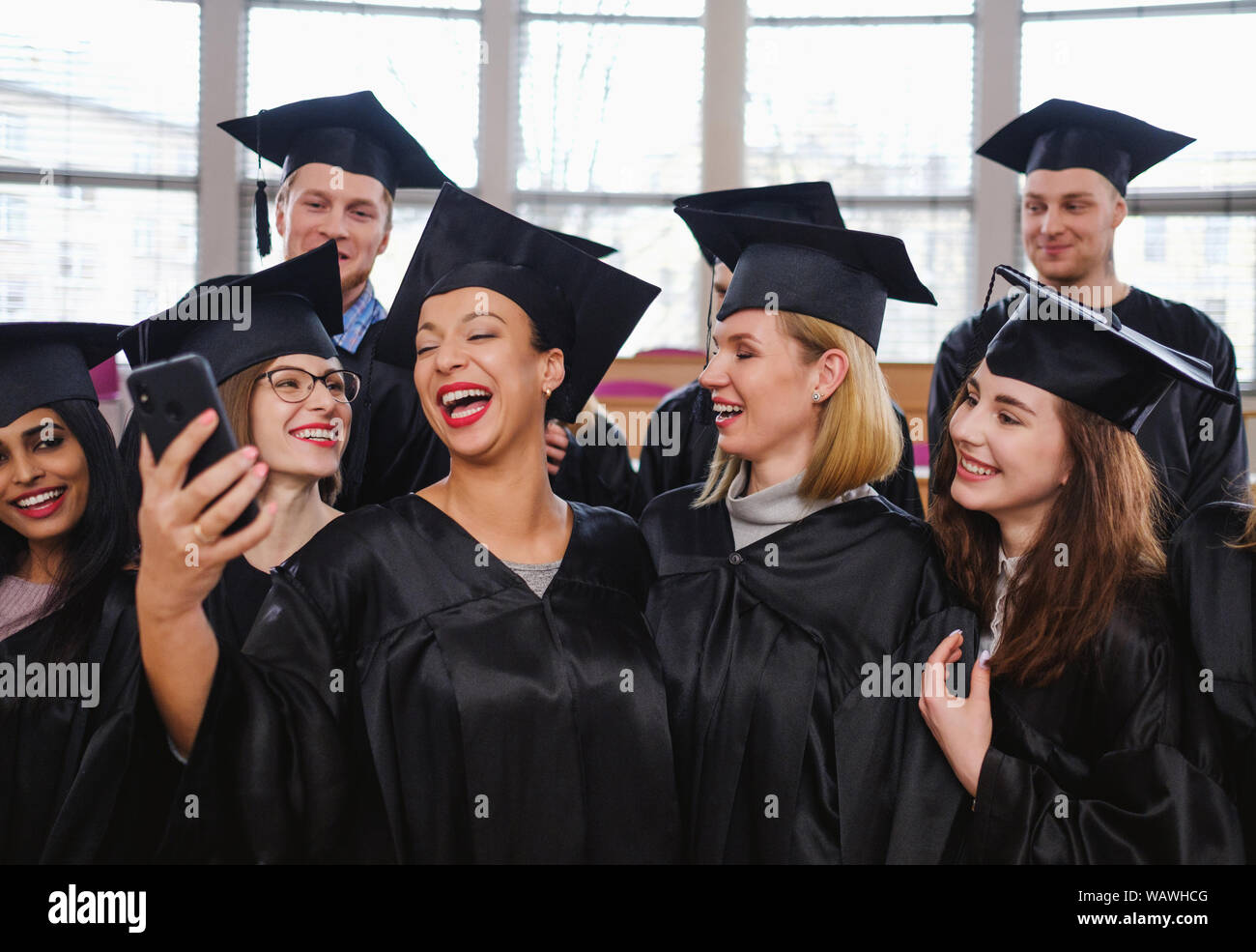 Multi ethnic group of graduated students taking selfie Stock Photo - Alamy