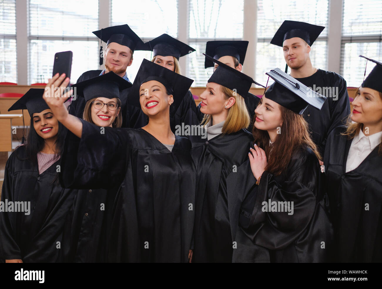 Multi ethnic group of graduated students taking selfie Stock Photo - Alamy