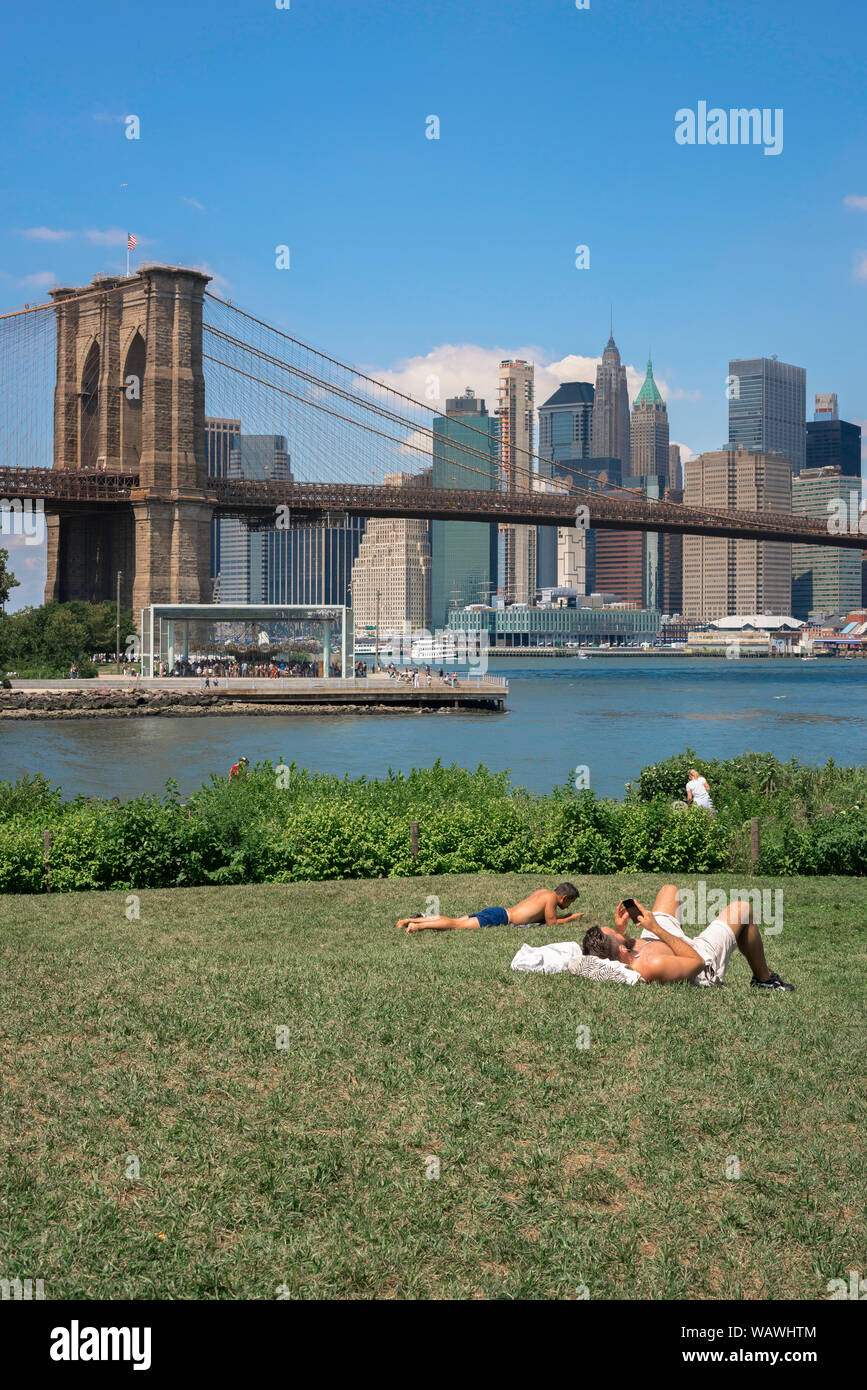 Brooklyn summer, view of men sunbathing in Main Street Park, Brooklyn ...