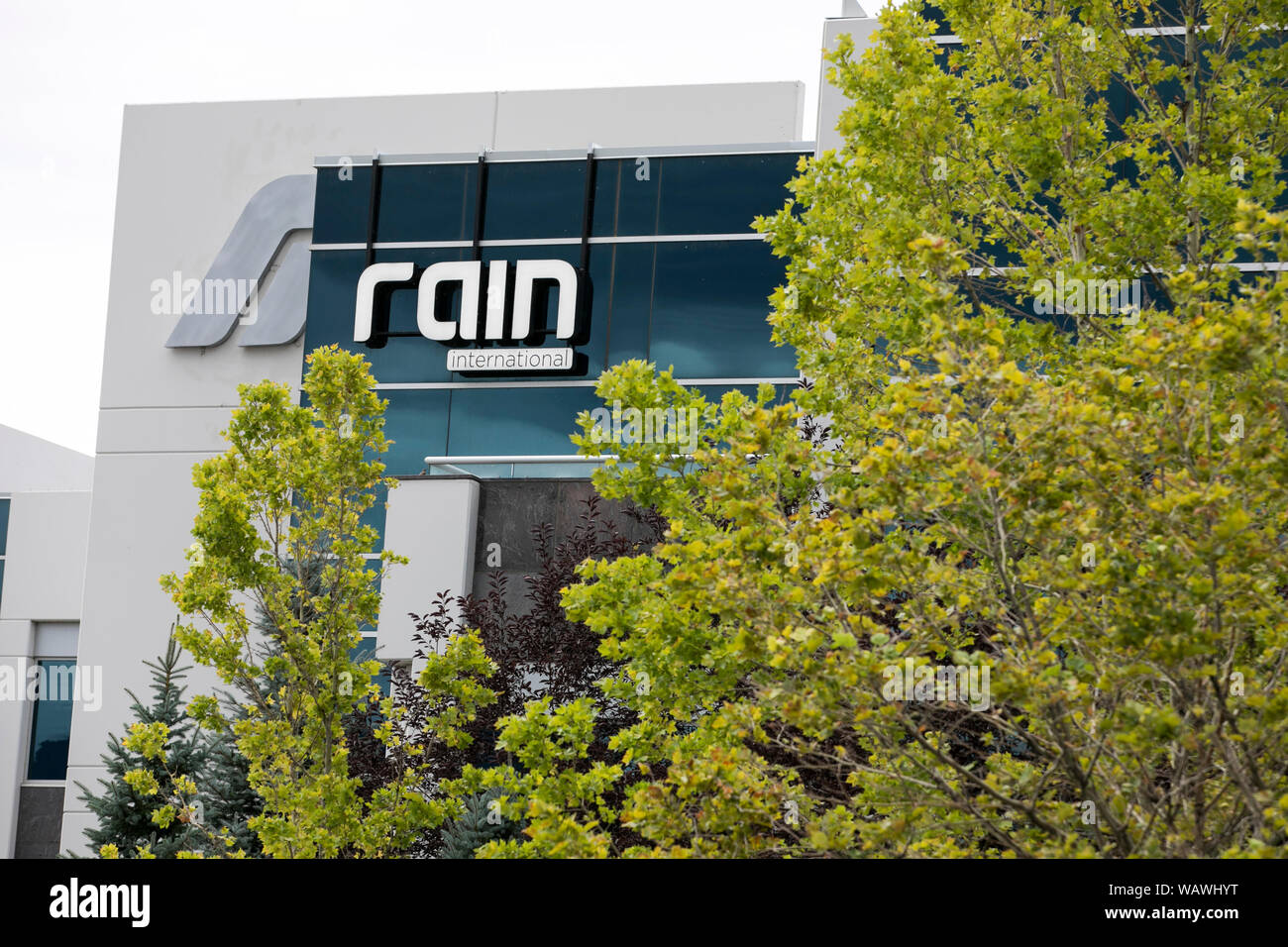 A logo sign outside of the headquarters of Rain International in ...