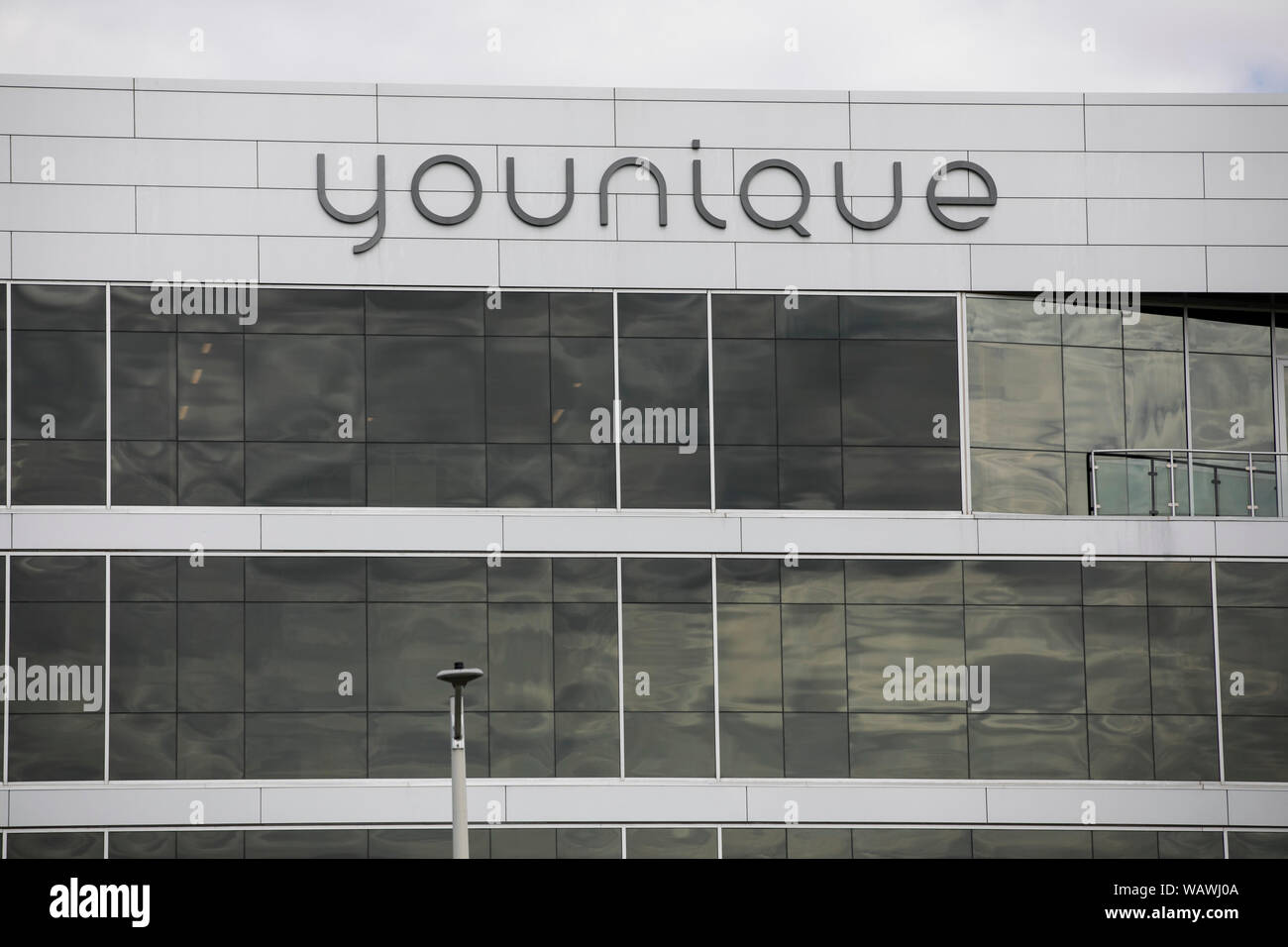 A logo sign outside of the headquarters of Younique in Lehi, Utah on ...