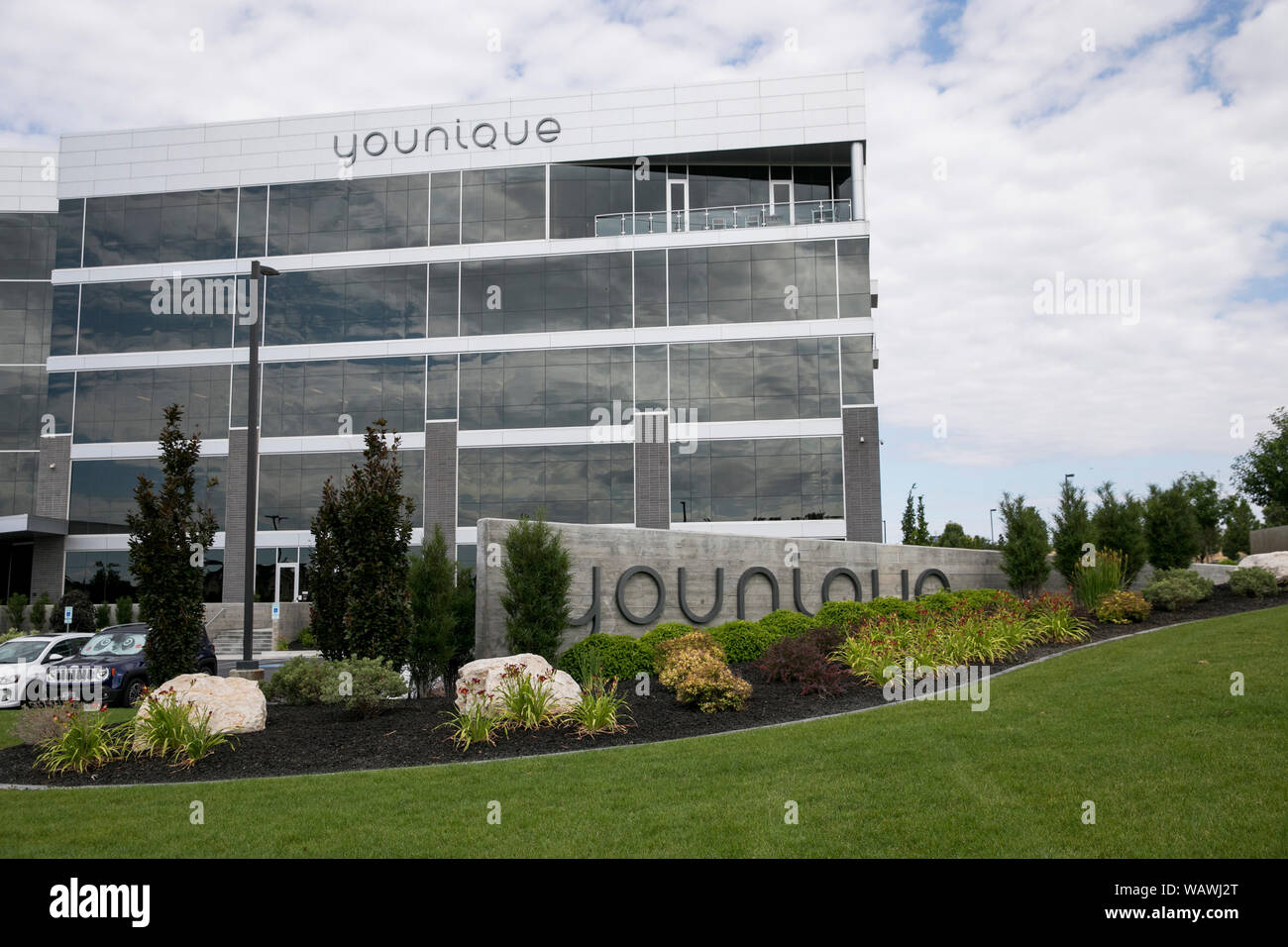 A logo sign outside of the headquarters of Younique in Lehi, Utah on ...