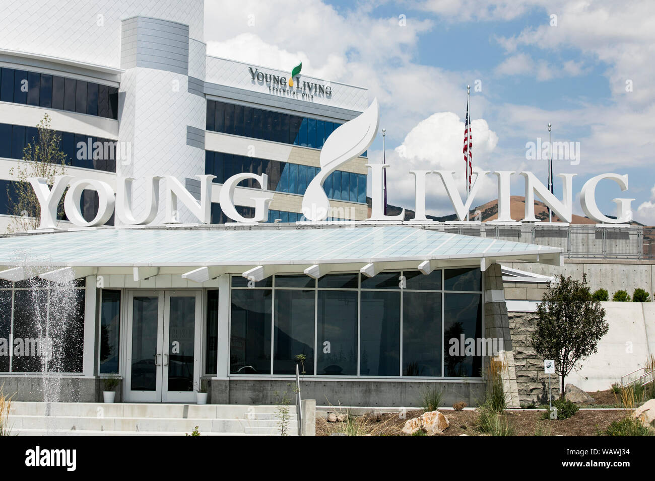 A logo sign outside of the headquarters of Young Living in Lehi, Utah on July 27, 2019 Stock ...