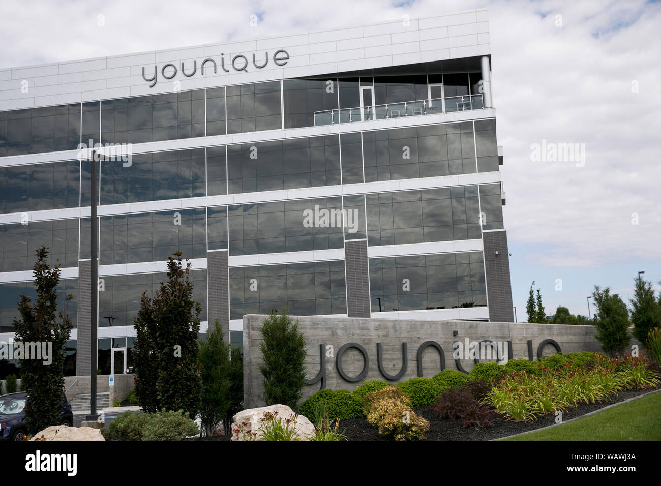 A logo sign outside of the headquarters of Younique in Lehi, Utah on ...