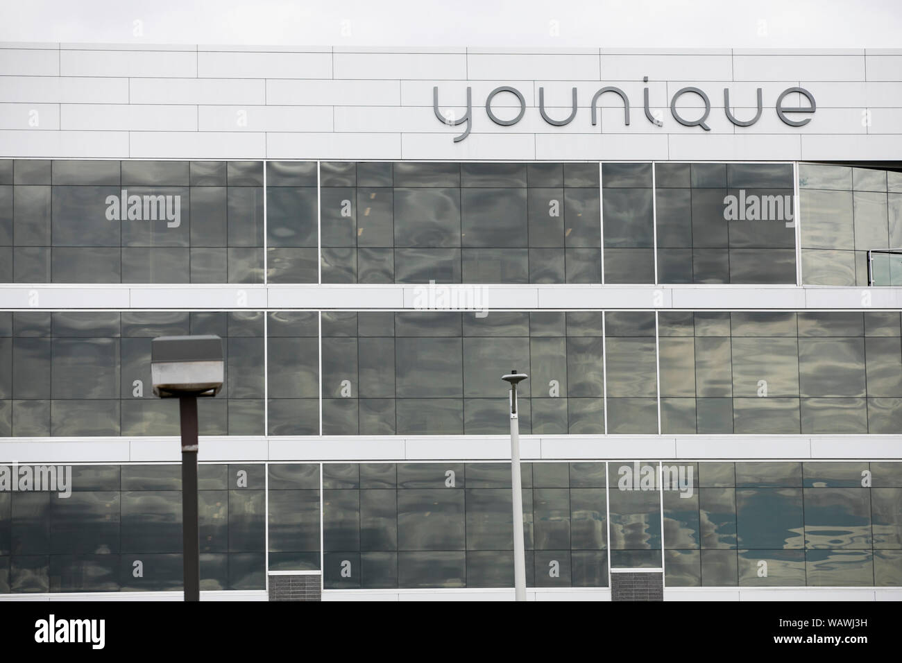 A logo sign outside of the headquarters of Younique in Lehi, Utah on ...