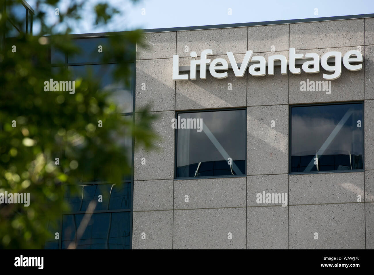 A logo sign outside of the headquarters of LifeVantage in Sandy, Utah ...
