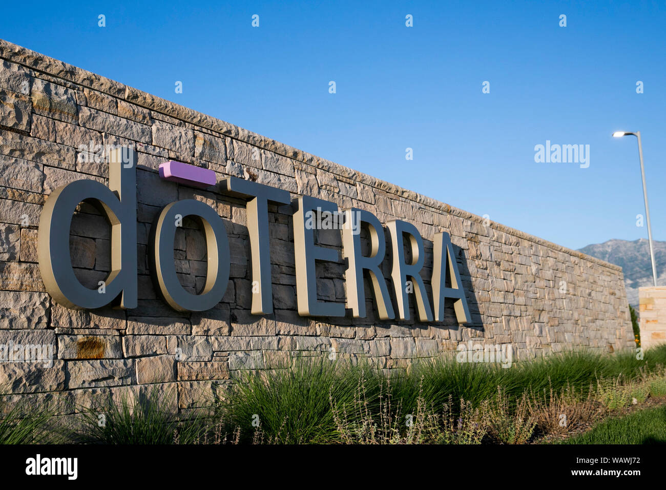 A logo sign outside of the headquarters of doTerra in Pleasant Grove ...
