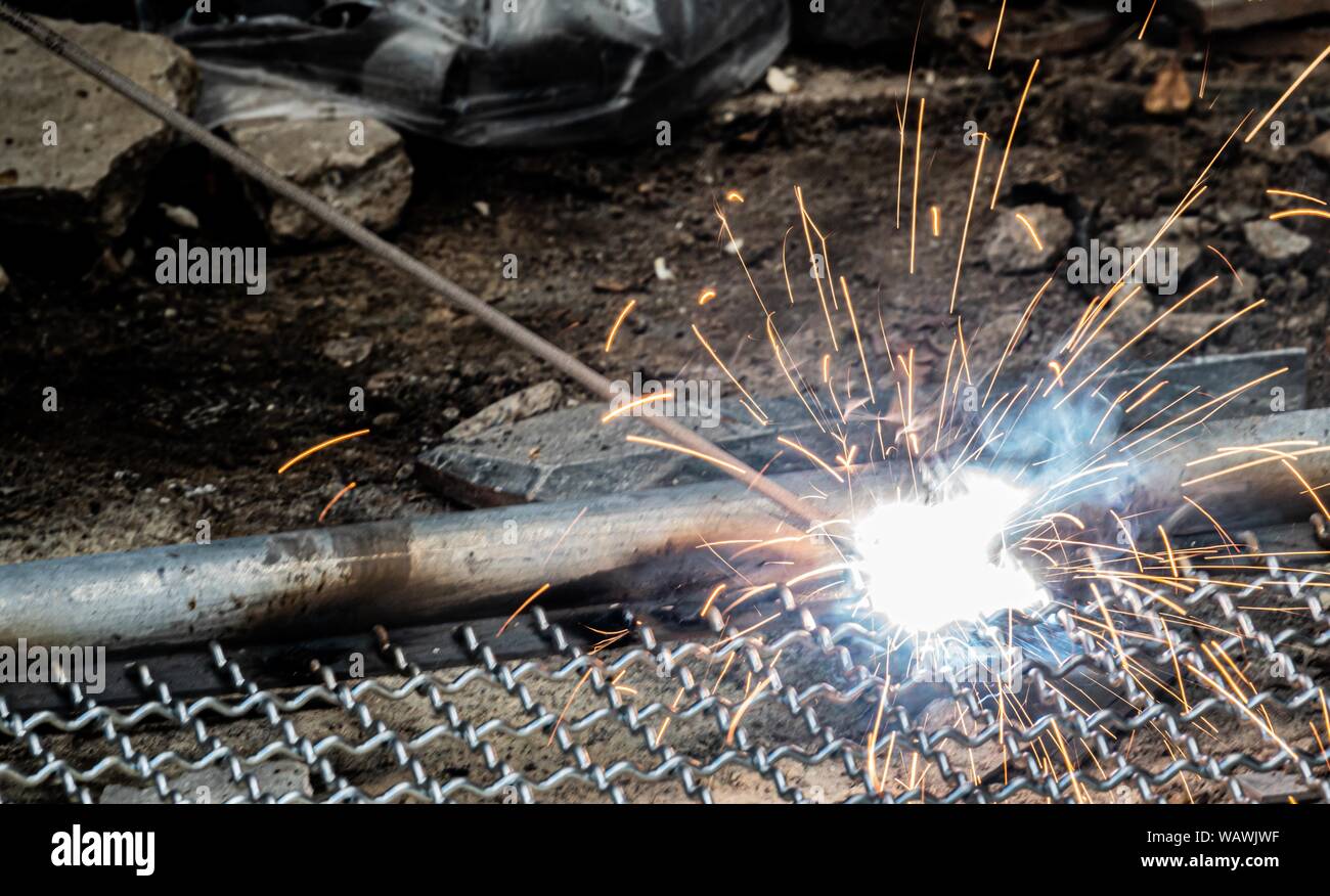 worker used electric welding wire mesh to make bird cage Stock Photo ...
