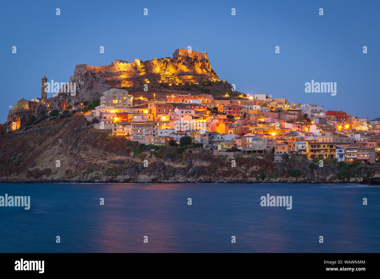 Colorful houses on the hillside with a fortress on the top. Night ...