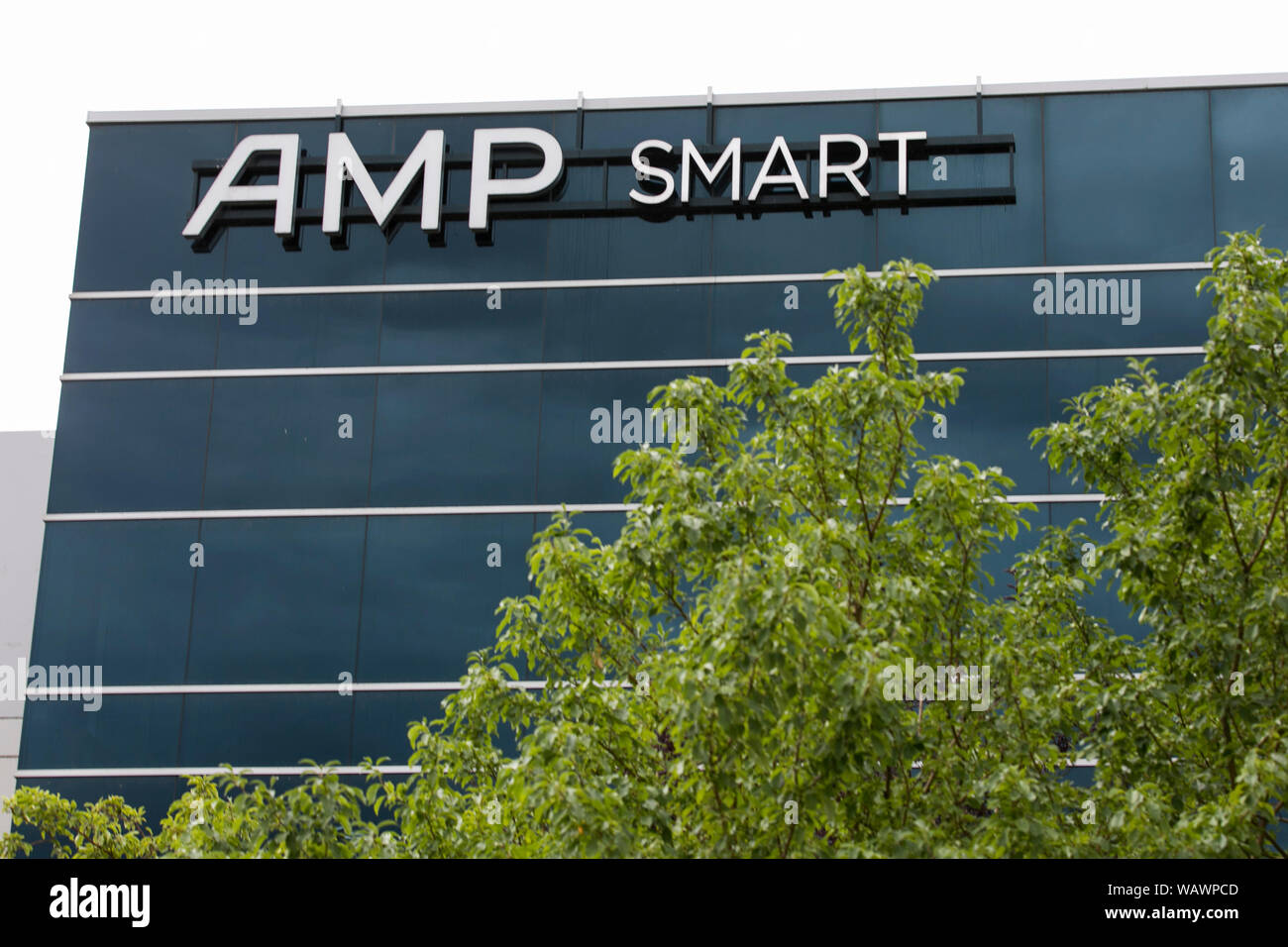 A logo sign outside of the headquarters of AMP Smart in American Fork ...