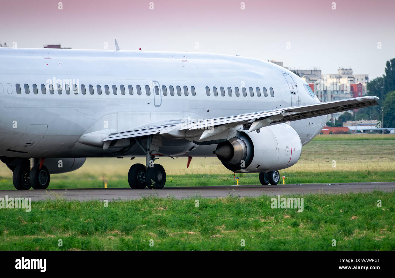 Passenger jet plane is taxiing to the runway for takeoff or after ...
