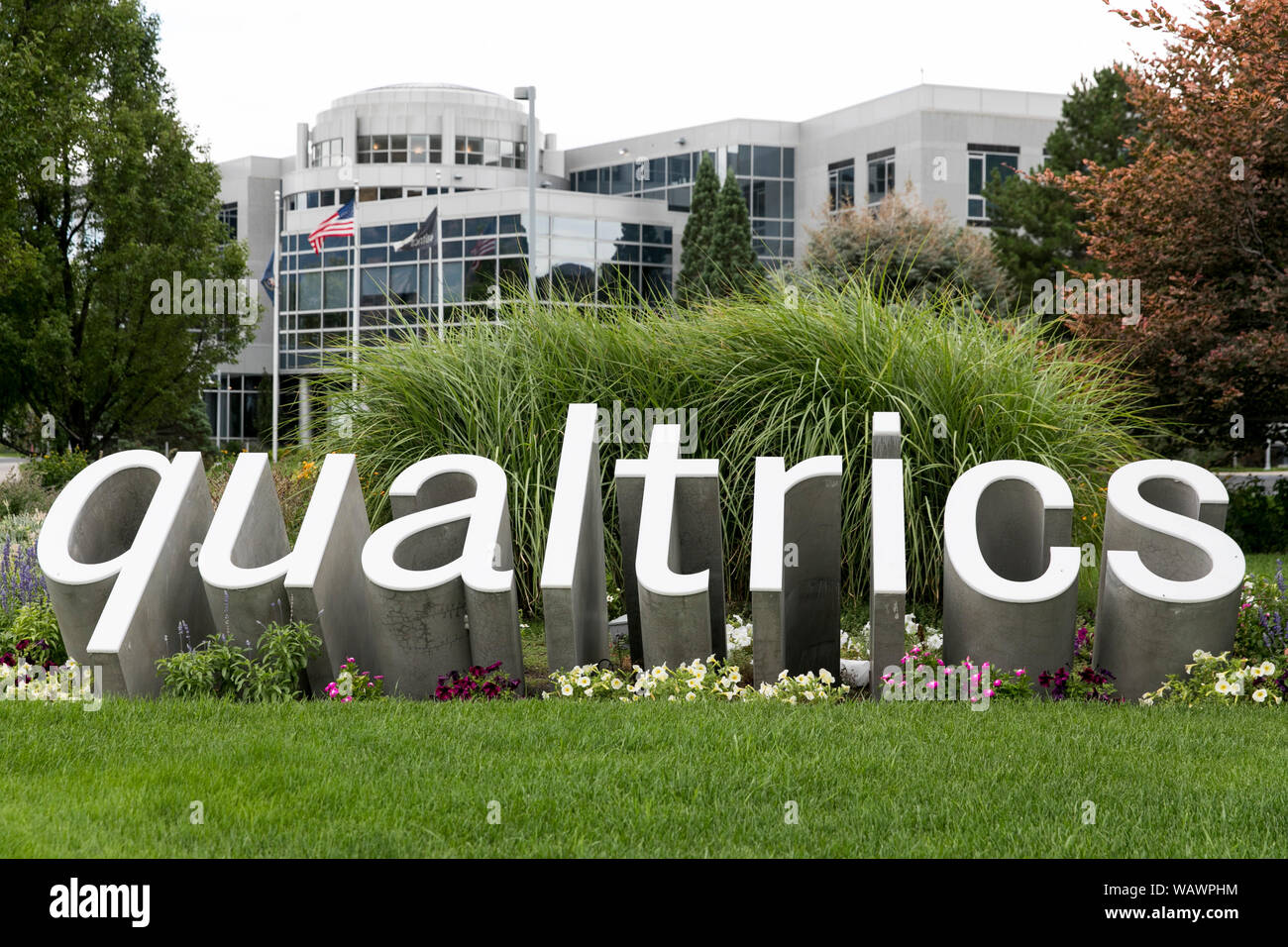A logo sign outside of the headquarters of Qualtrics in Provo, Utah on ...